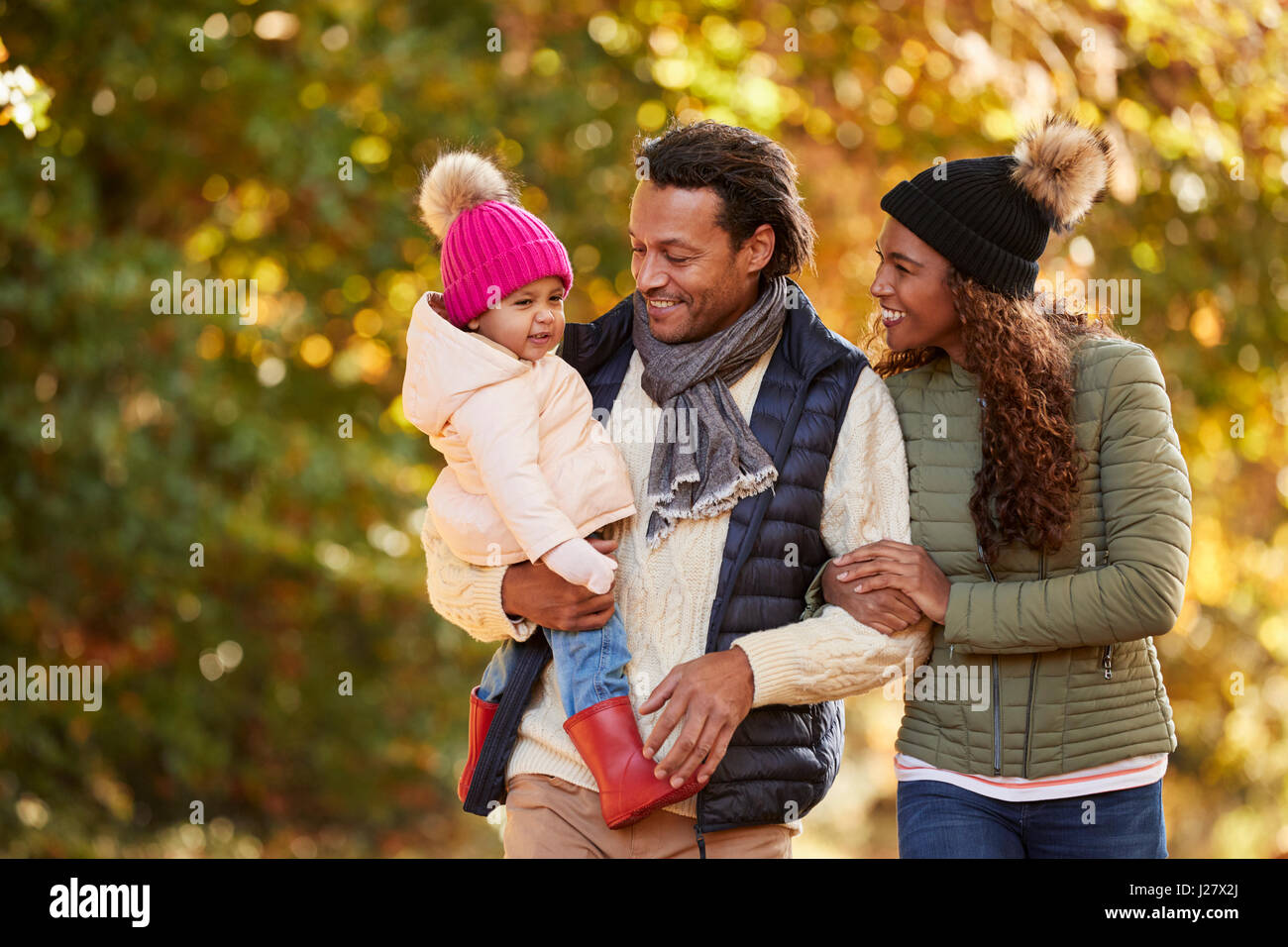 Family With Young Daughter Enjoying Autumn Countryside Walk Stock Photo ...