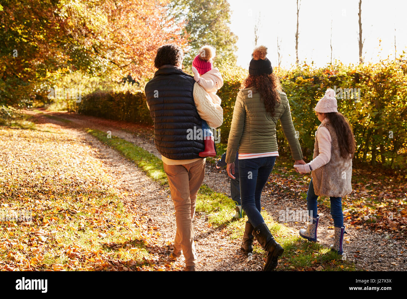 Rear View Of Family Enjoying Autumn Walk In Countryside Stock Photo - Alamy