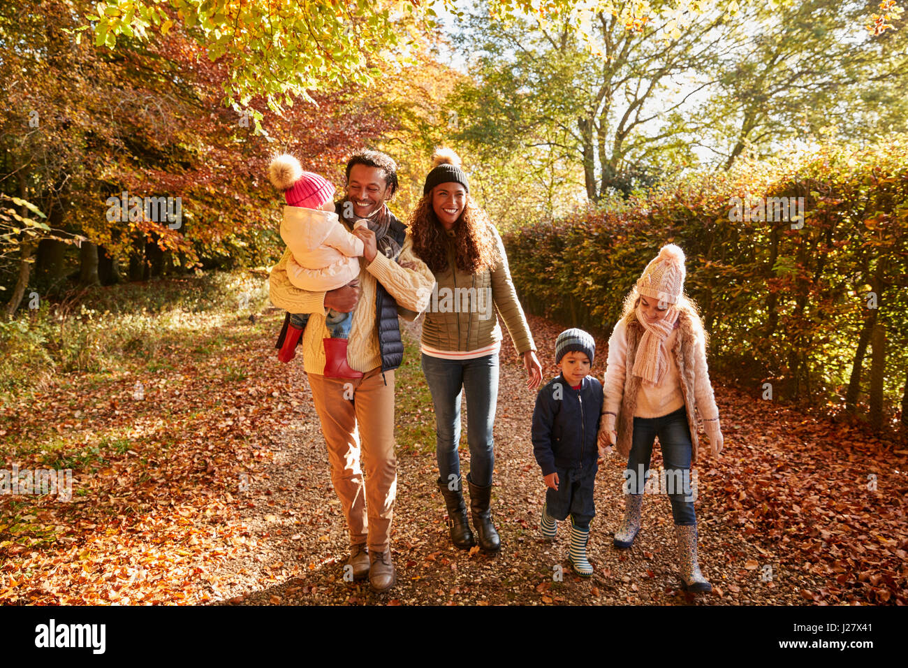 Front View Of Family Enjoying Autumn Walk In Countryside Stock Photo ...