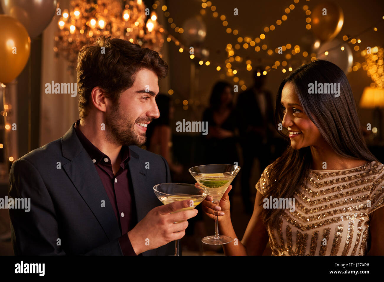 Couple Make Toast As They Celebrate At Party Together Stock Photo - Alamy