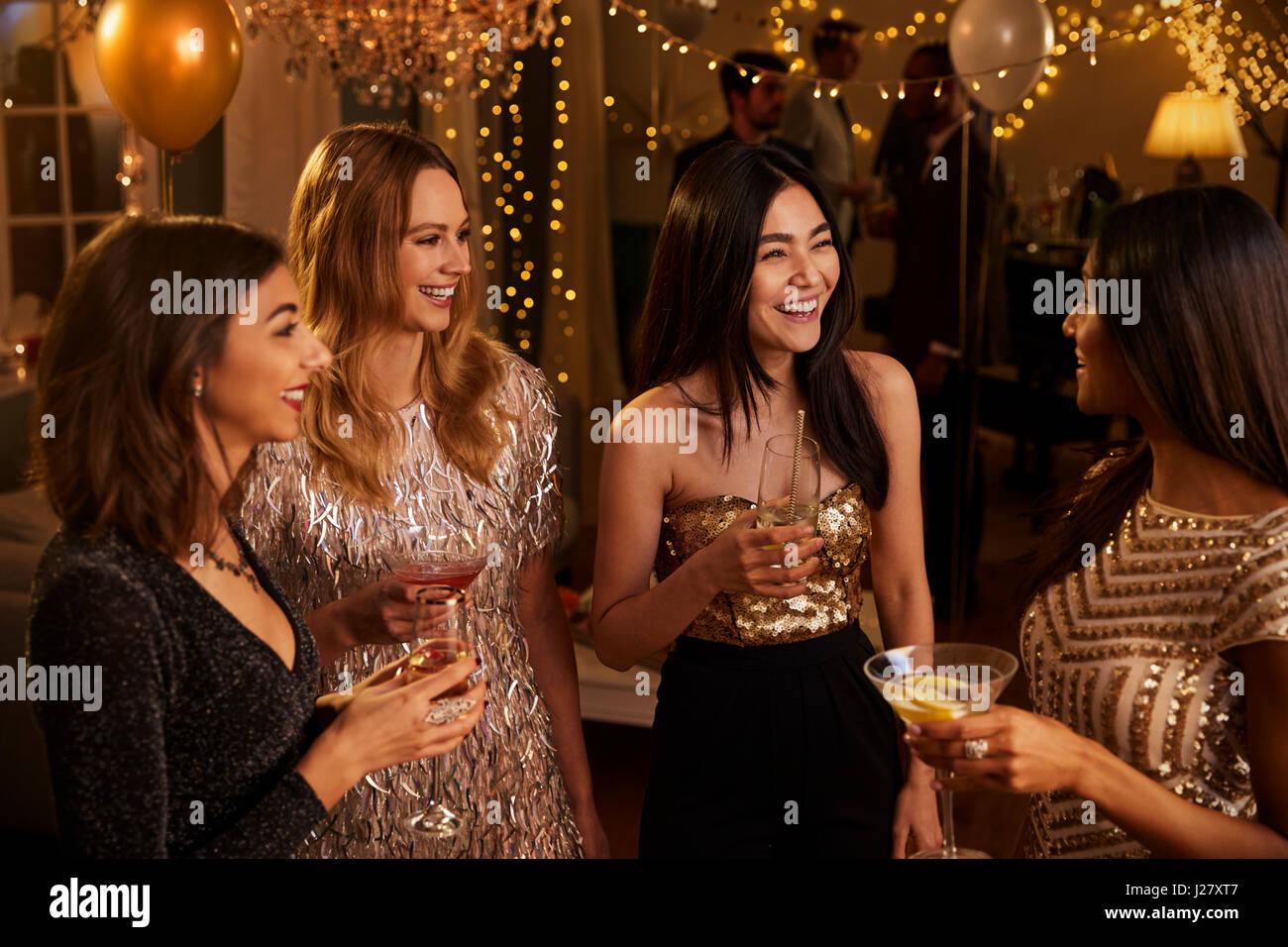Group Of Female Friends Enjoying Cocktail Party Together Stock Photo ...