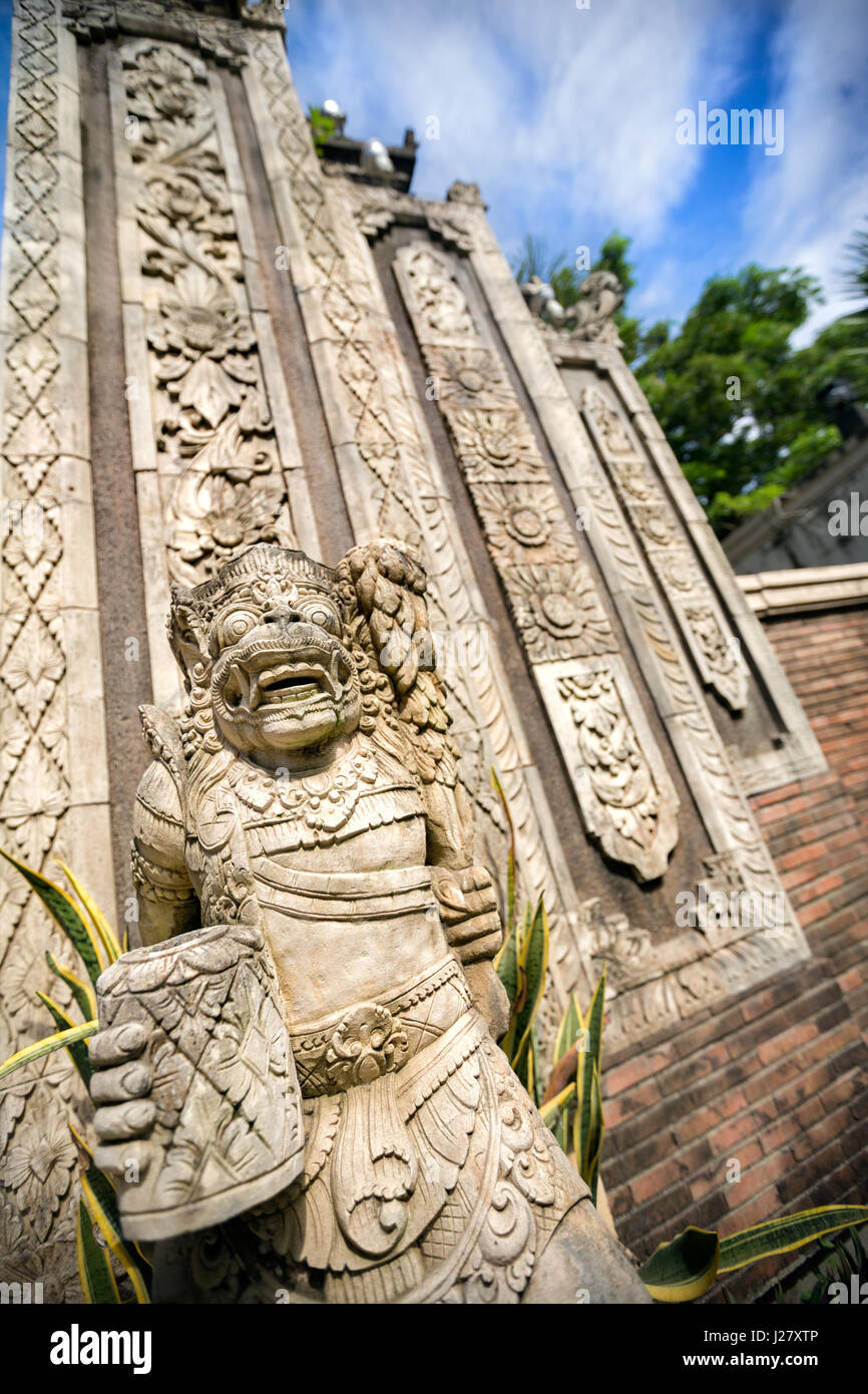 Statues and carvings depicting demons, gods and Balinese mythological ...