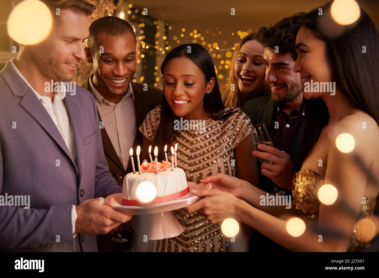 Group Of Friends Celebrating Birthday With Party At Home Stock Photo ...