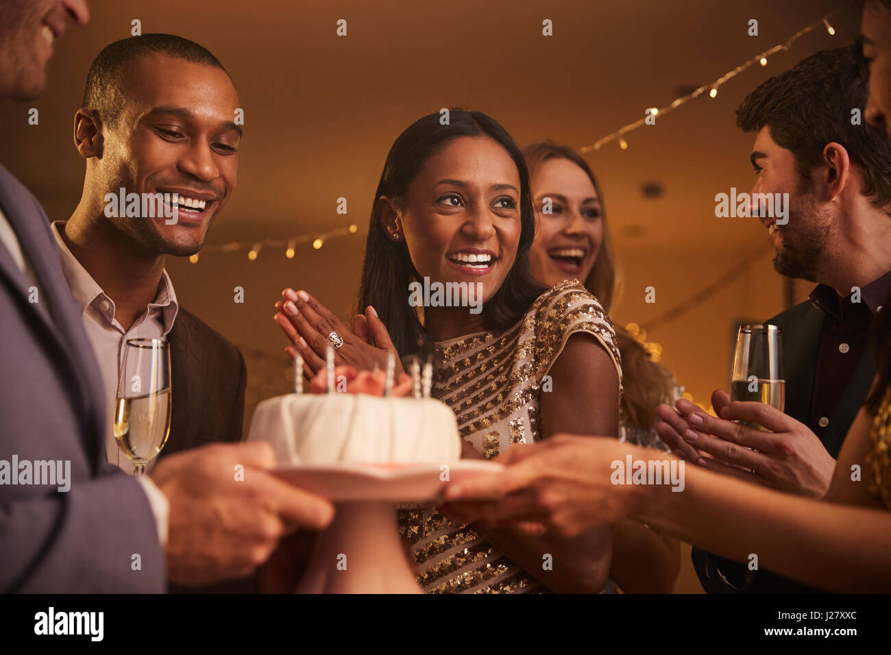 Group Of Friends Celebrating Birthday With Party At Home Stock Photo ...
