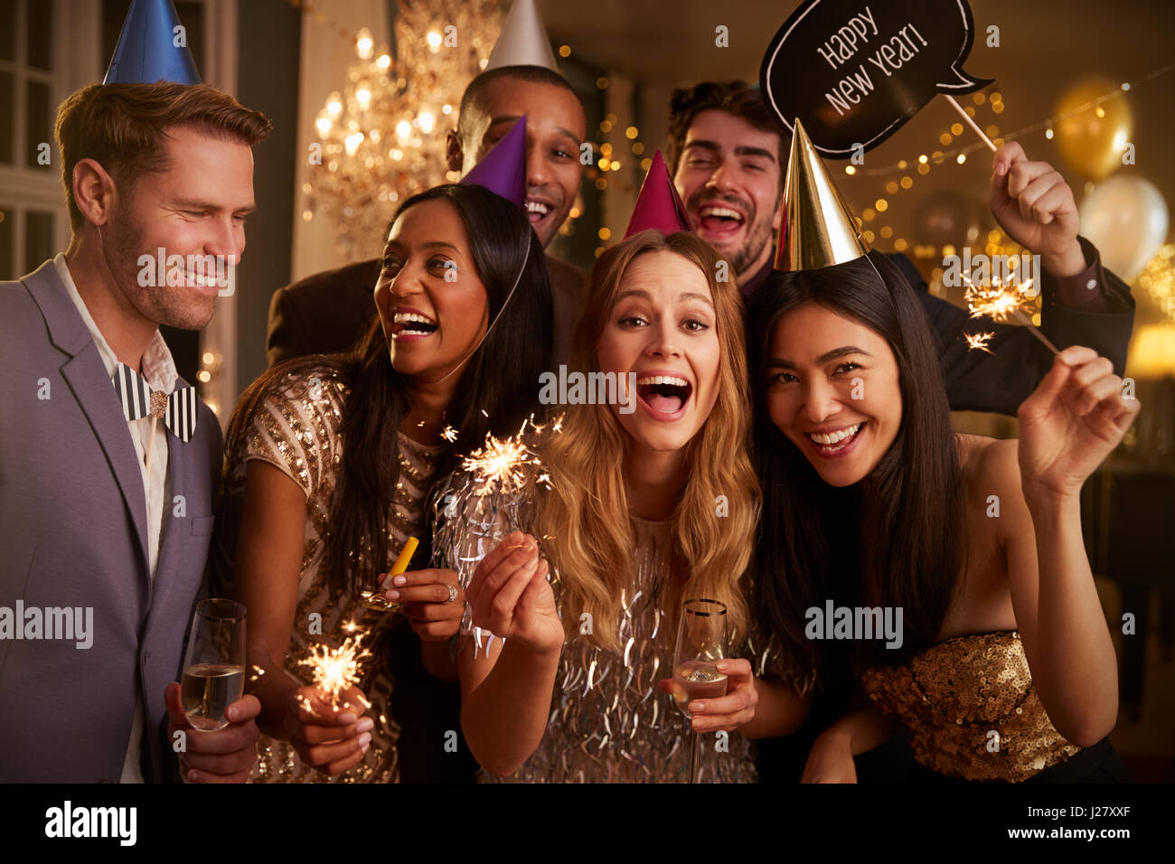 Group Of Friends Celebrating At New Year Party Together Stock Photo - Alamy