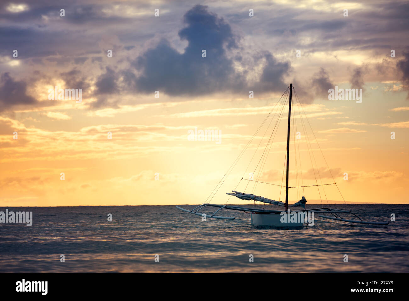 fishing boat sailing alone at sea over beautiful sky Stock Photo - Alamy