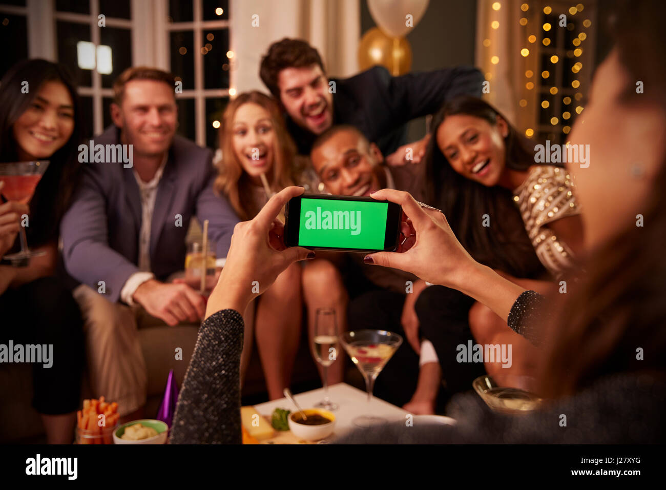 Friends Posing For Photo As They Have Fun At Party Together Stock Photo ...