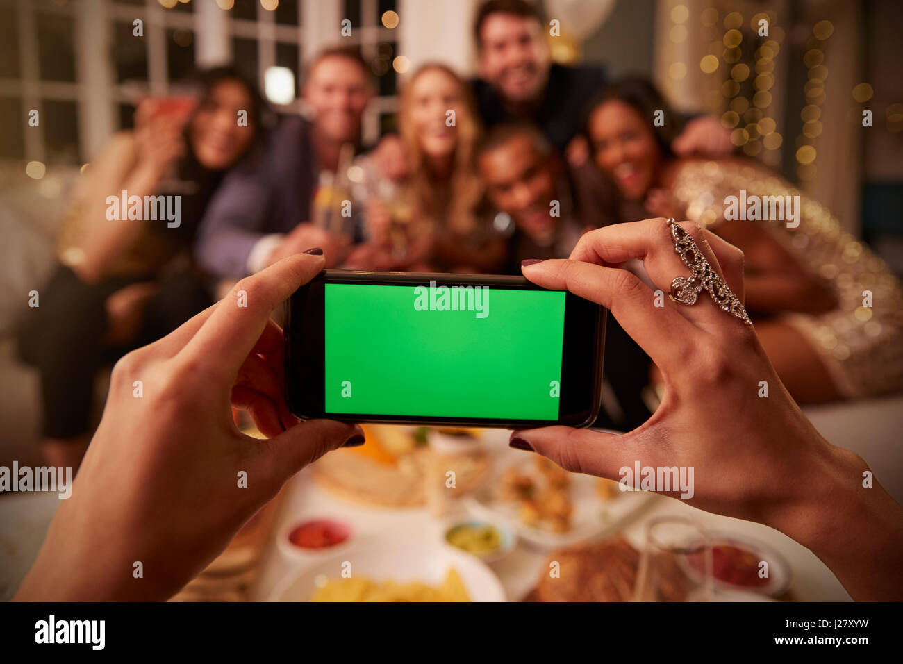 Friends Posing For Photo As They Have Fun At Party Together Stock Photo ...