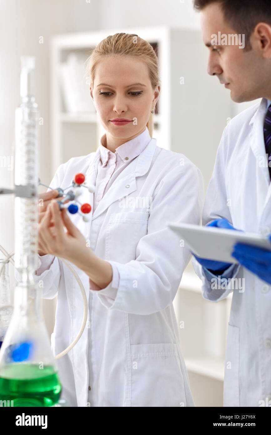 group of scientist analyzing molecular structure in laboratory Stock Photo - Alamy