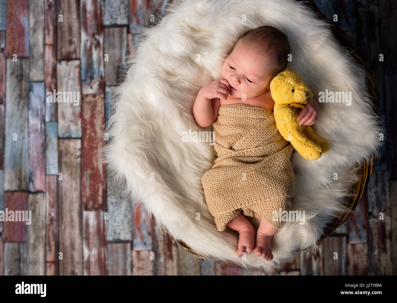 Adorable little newborn baby hugging his first teddy bear Stock Photo ...