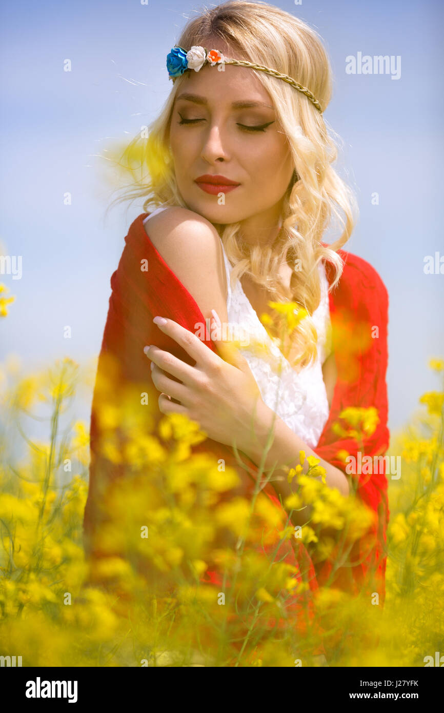 Spring woman enjoy in canola field Stock Photo - Alamy