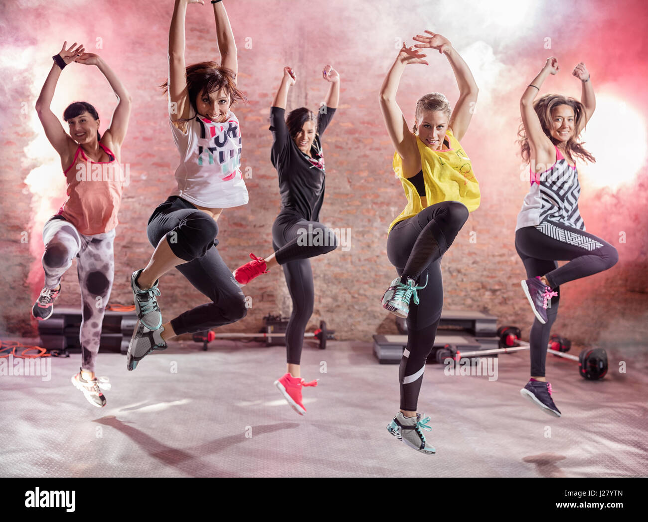 Group of young women dancing, fun and exercising Stock Photo - Alamy