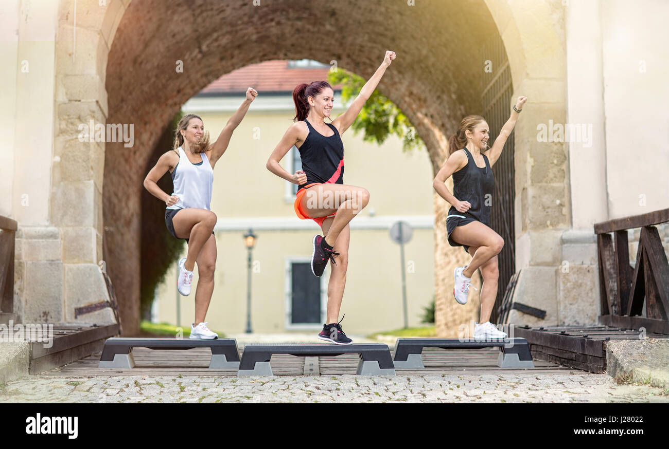 smiling women stepping training on stepper outdoor Stock Photo - Alamy