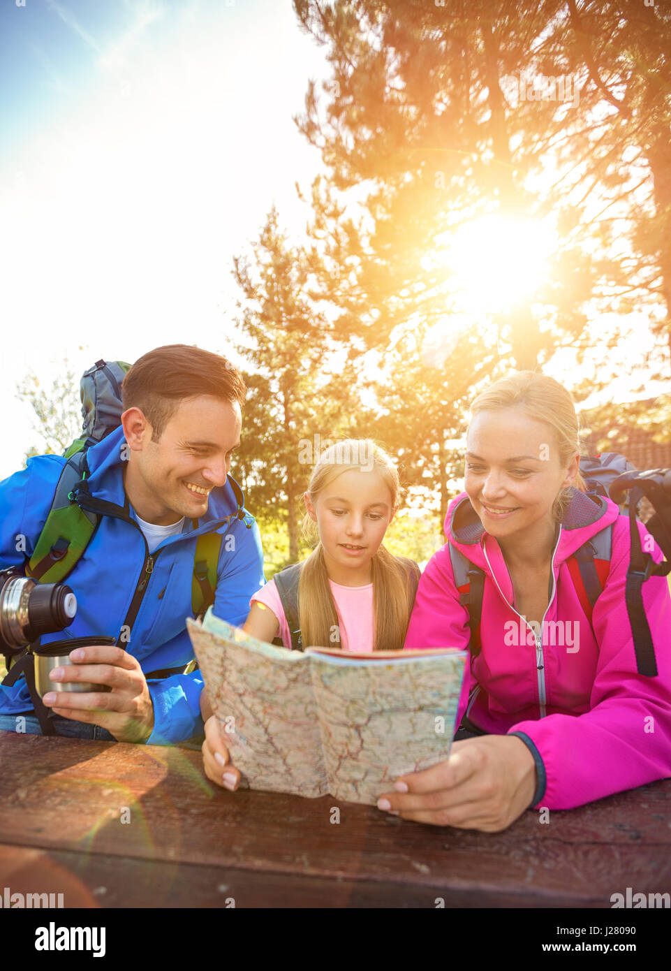 parents and child looking map on the hiking Stock Photo - Alamy