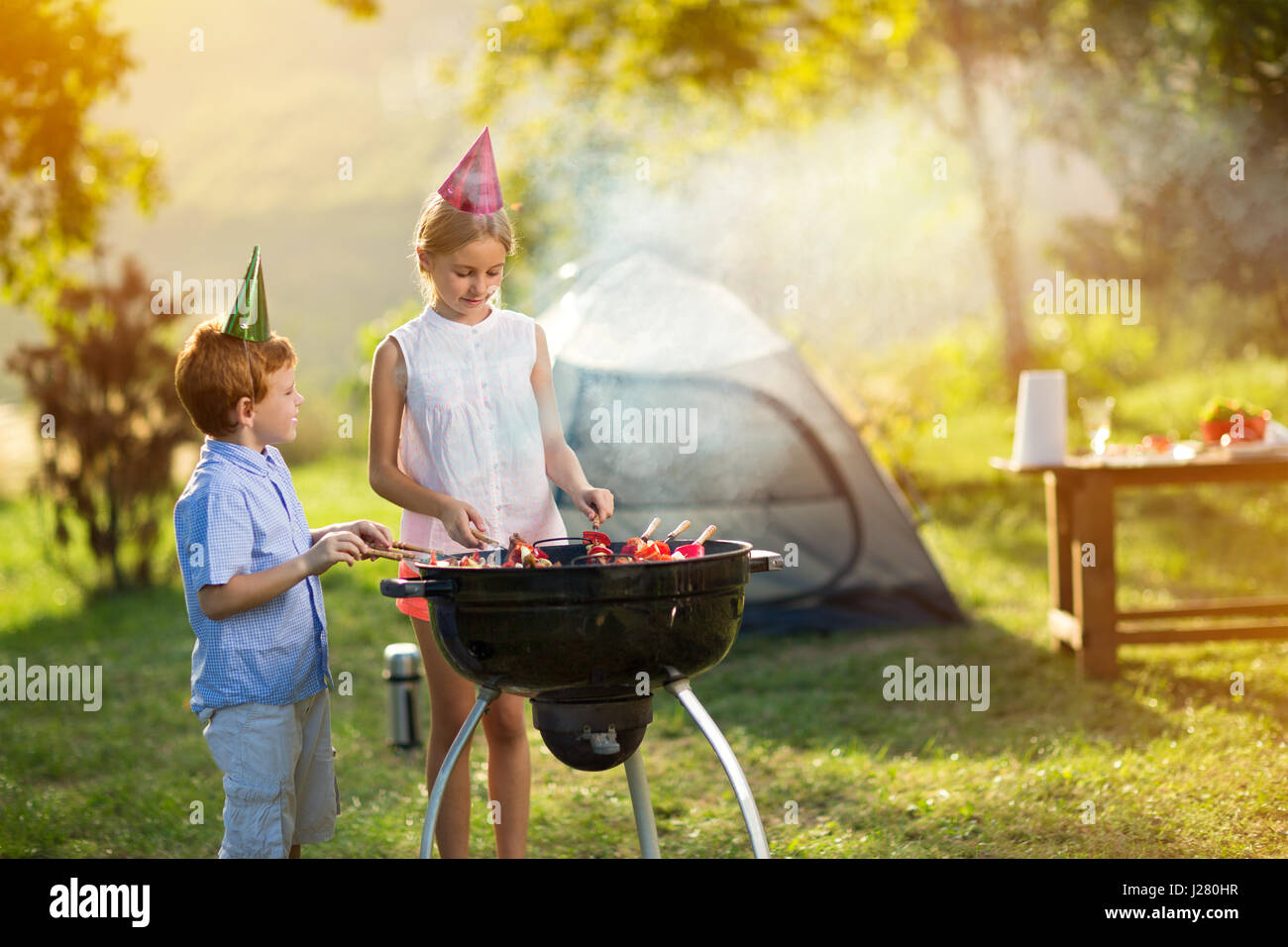 fun barbecue party in park Stock Photo - Alamy