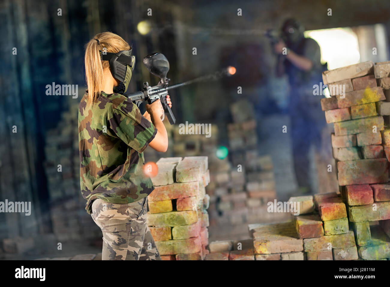 Shooter behind fortification during shootout Stock Photo - Alamy