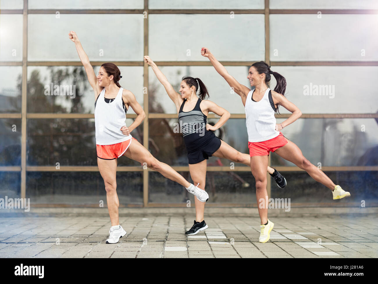 Athlete girls training aerobic outdoor Stock Photo - Alamy