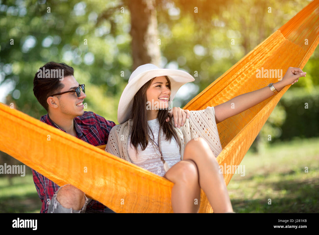 Young charming woman showing something in nature to her boyfriend Stock ...