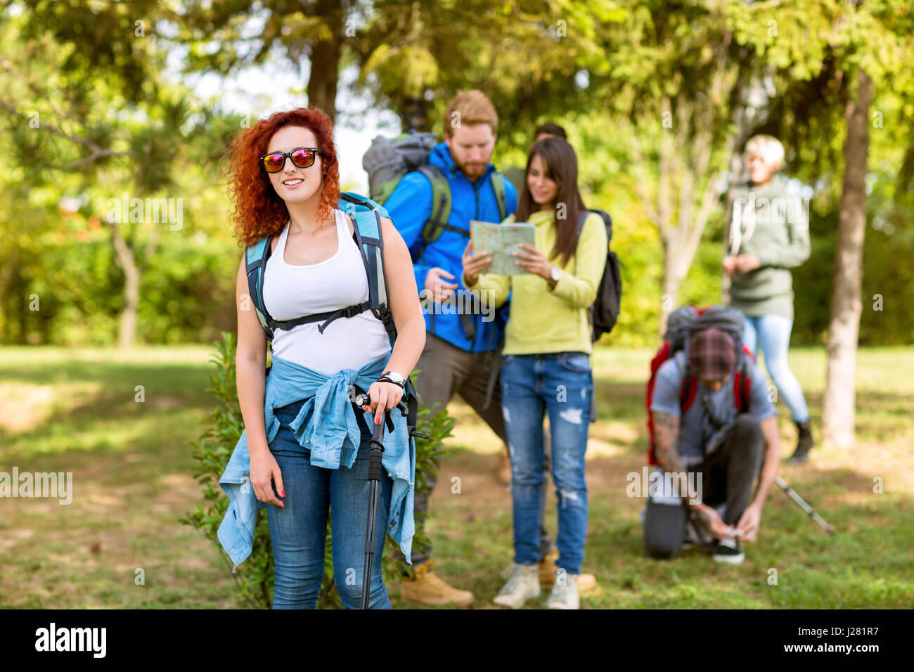 Group of youngsters walking in nature as hobby Stock Photo - Alamy