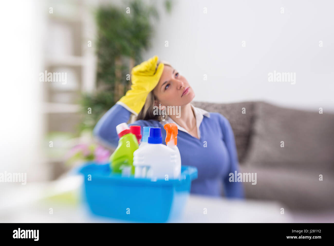 Female worker from cleaning service is tired of cleaning house Stock ...