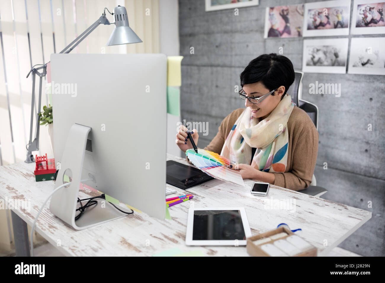 woman designer chooses color palette for work Stock Photo - Alamy
