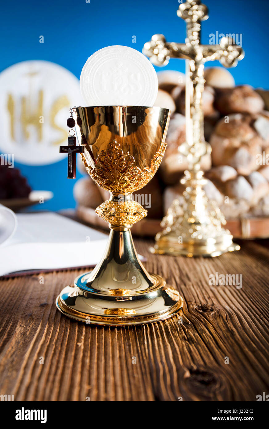 First Holy Communion. Catholic religion theme. Crucifix, Bible, bread ...