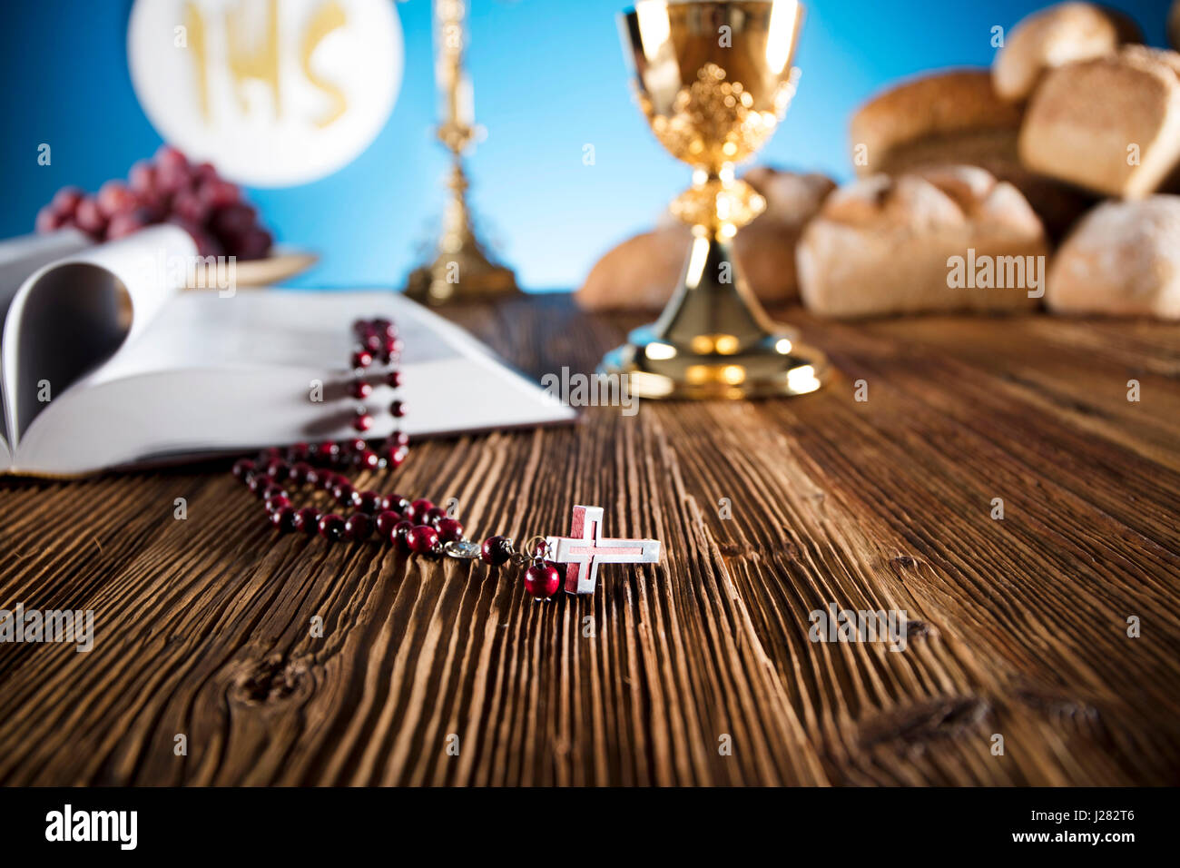 First Holy Communion. Catholic religion theme. Crucifix, Bible, bread ...