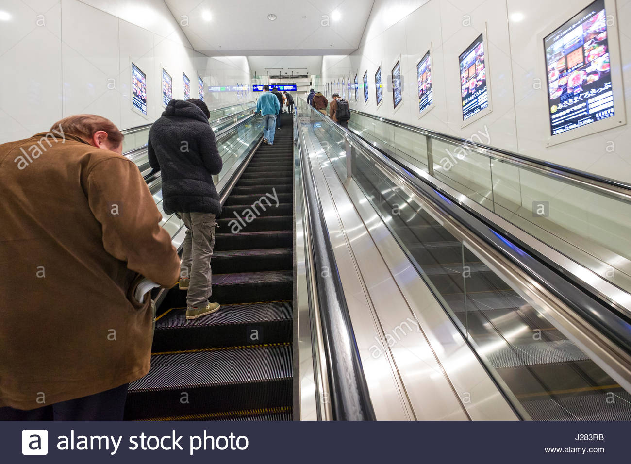 Riding Escalator High Resolution Stock Photography and Images - Alamy