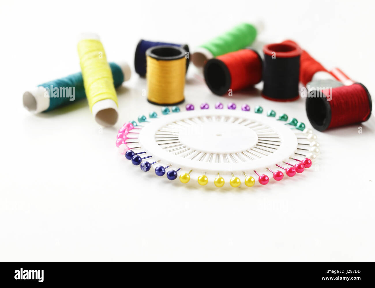 Threads, pins, needles - sewing tools Stock Photo - Alamy