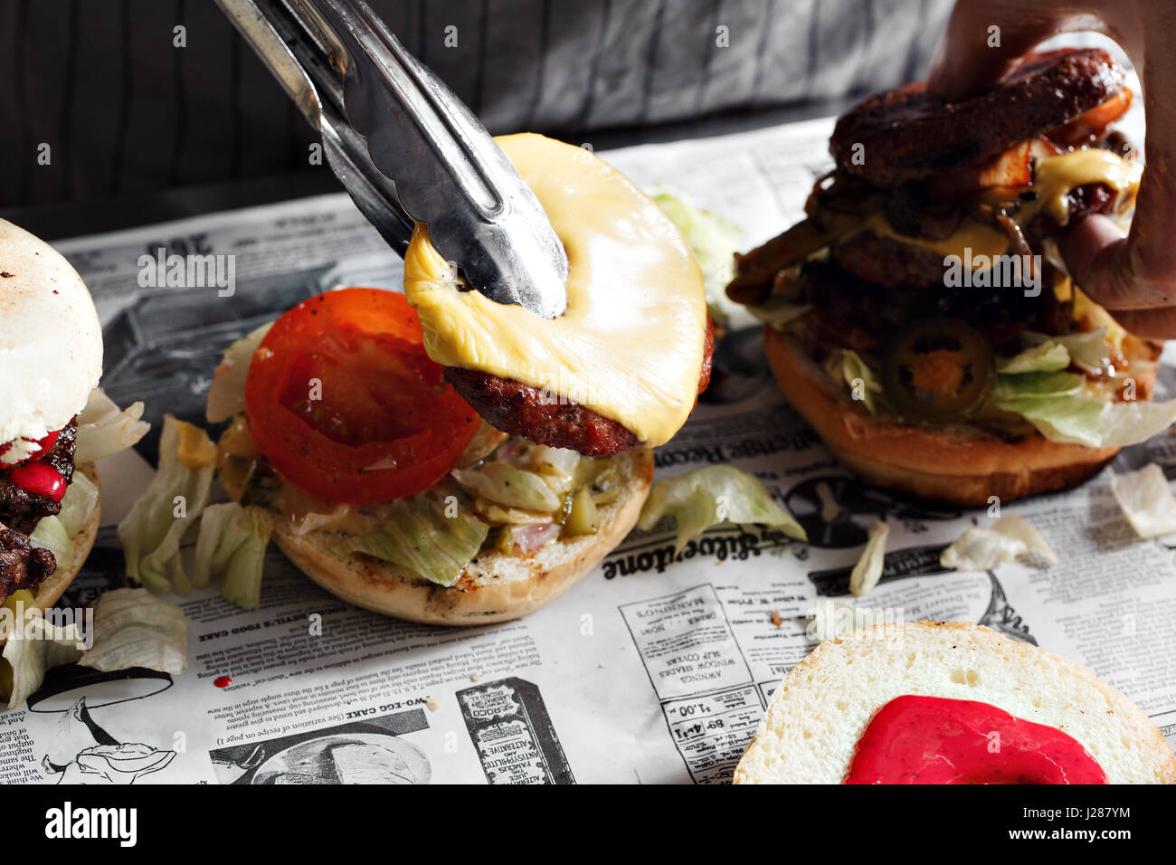 process of cooking hamburger. chef on the kitchen table making out the ...