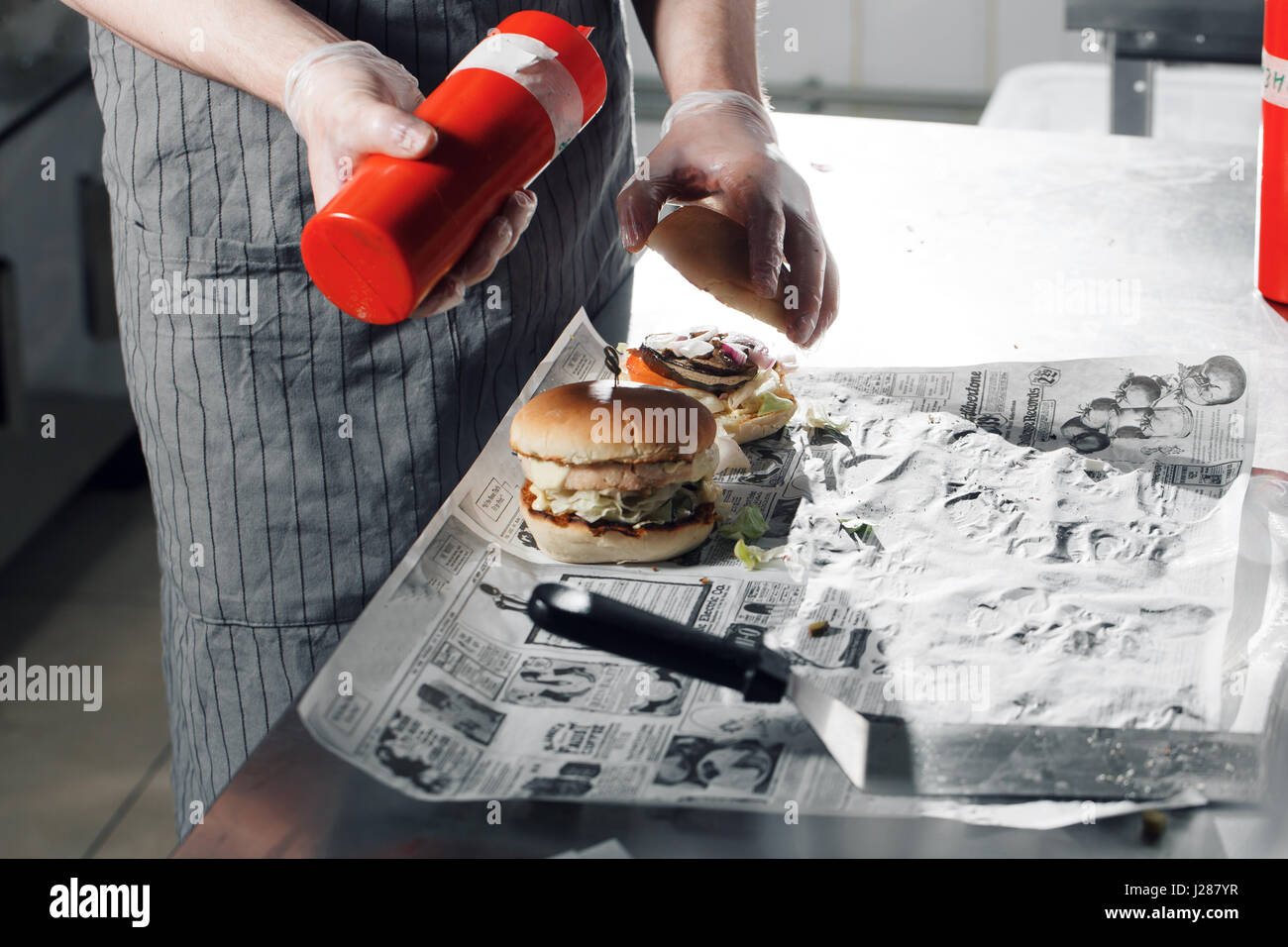 process of cooking hamburger. chef on the kitchen table making out the ...