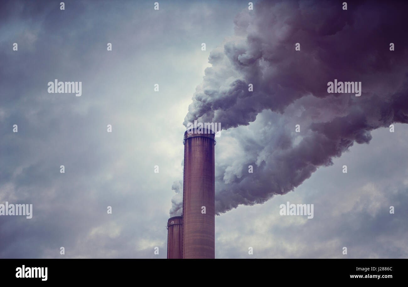 Industrial smokestacks emitting smoke into the sky Stock Photo - Alamy