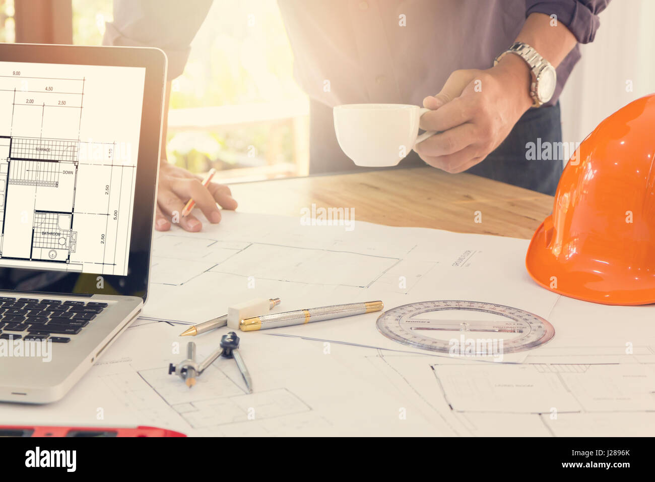 Architect concept, Architects working with blueprints in the office ...