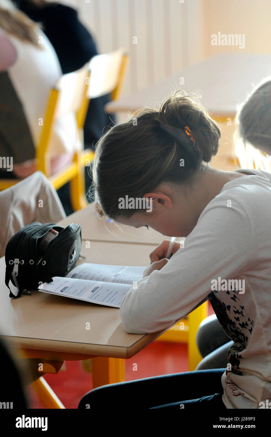 France, Western France, Ligne, young college student writing on her ...