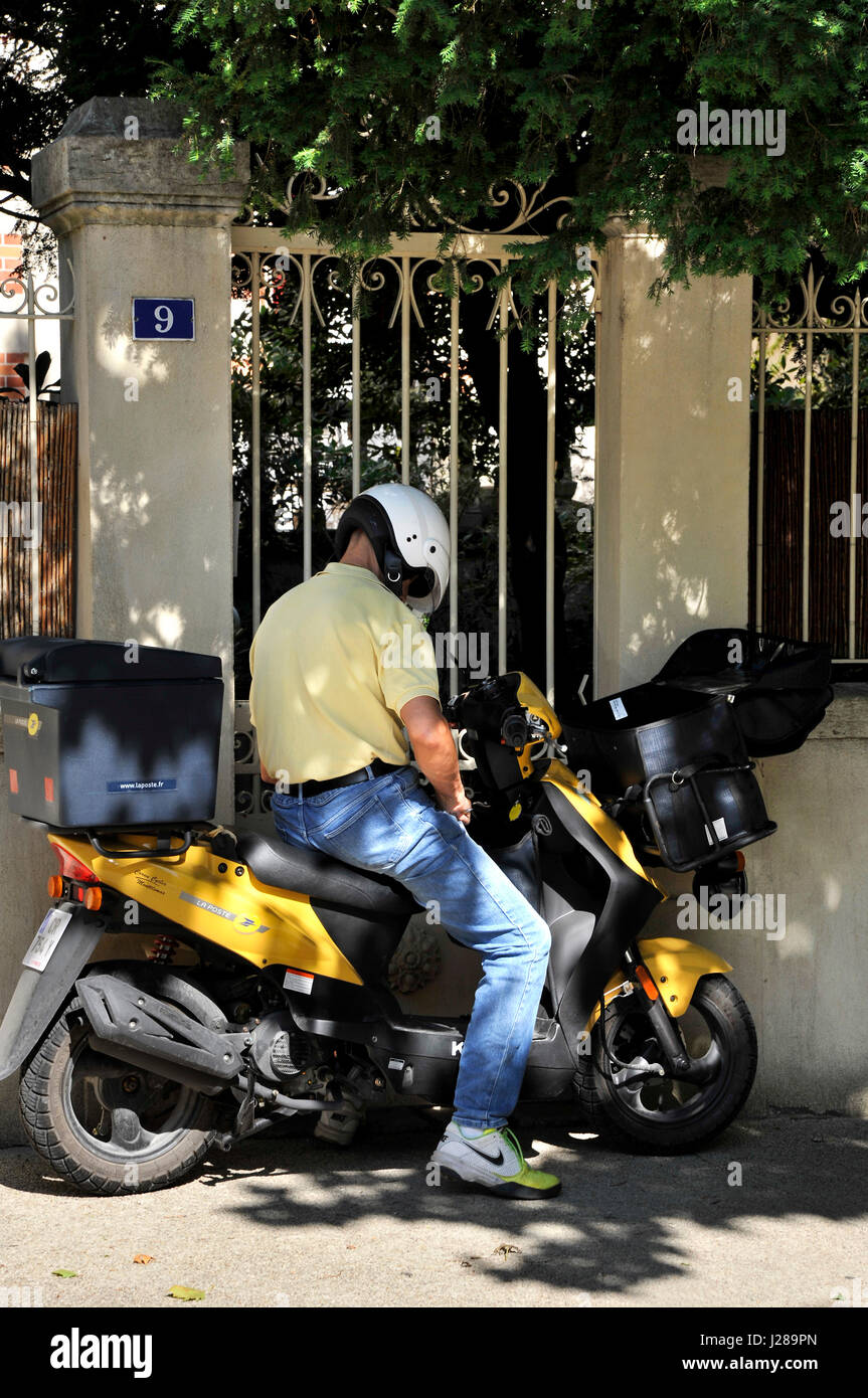 France, South-Eastern France, Montelimar, postman on a moped delivering ...