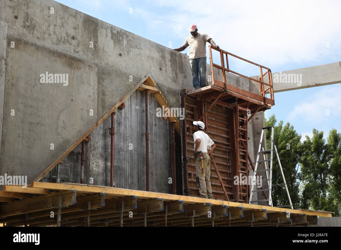 House building, raising the house's walls. Safety on a scaffold/scale ...