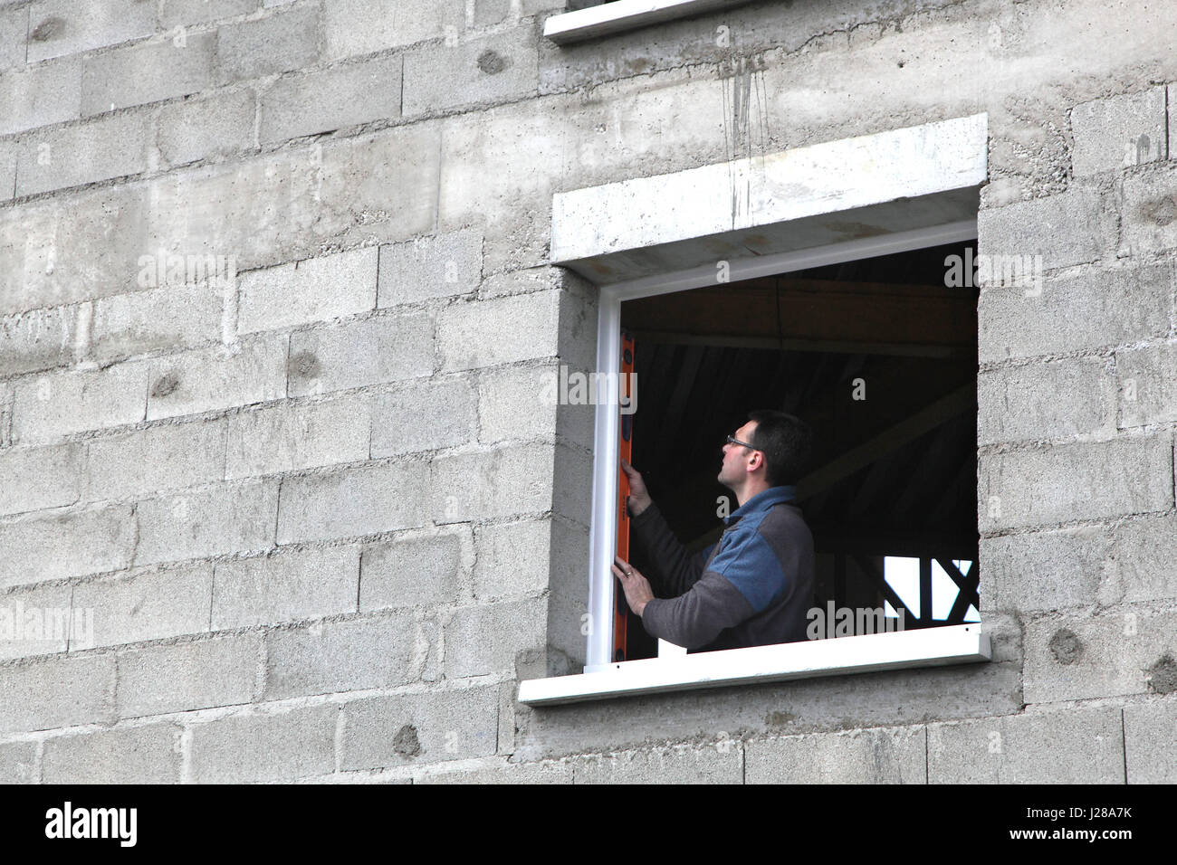 House building, window frame installation and open out windows Stock ...