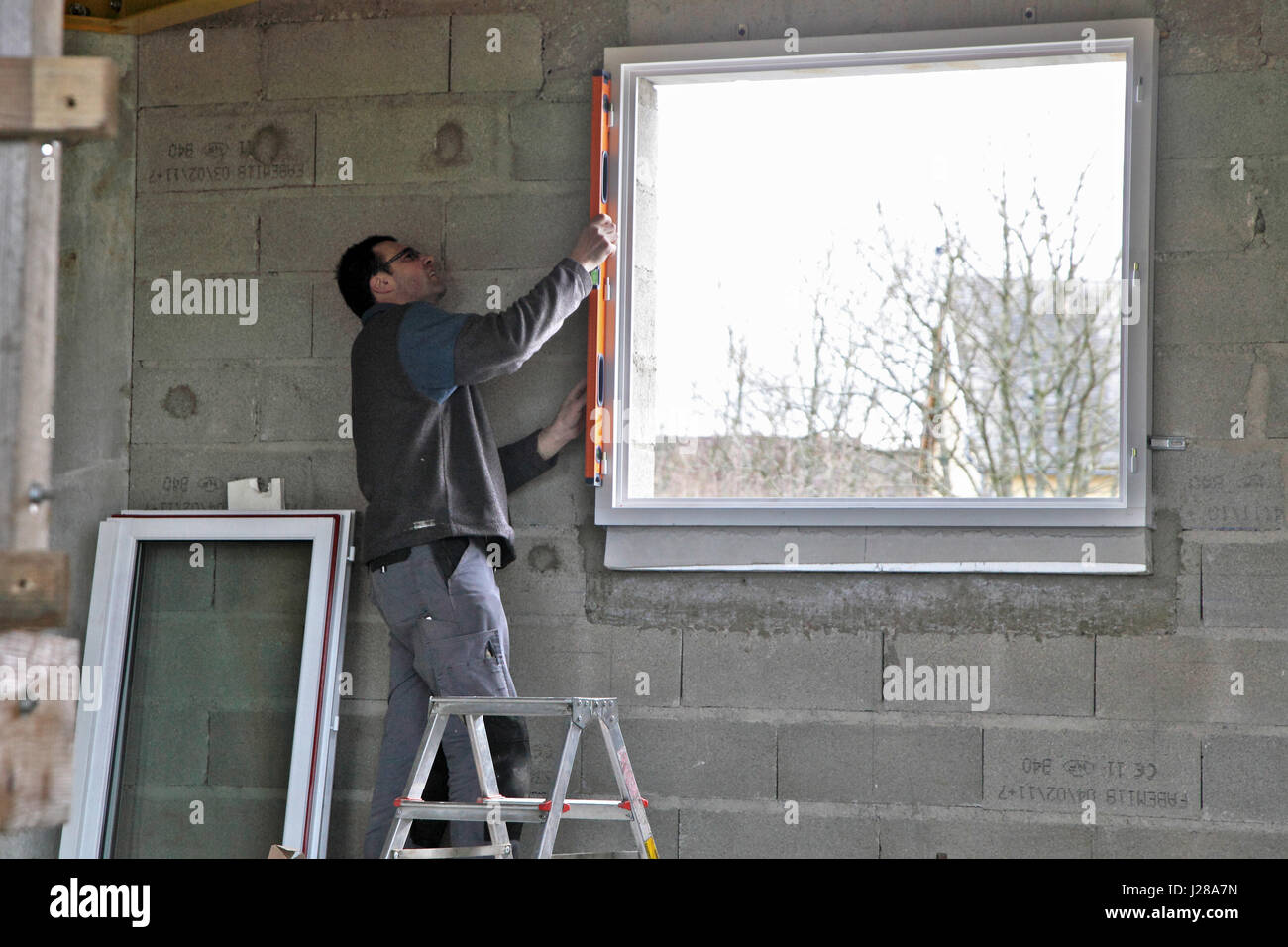 House building, window frame installation and open out windows Stock ...