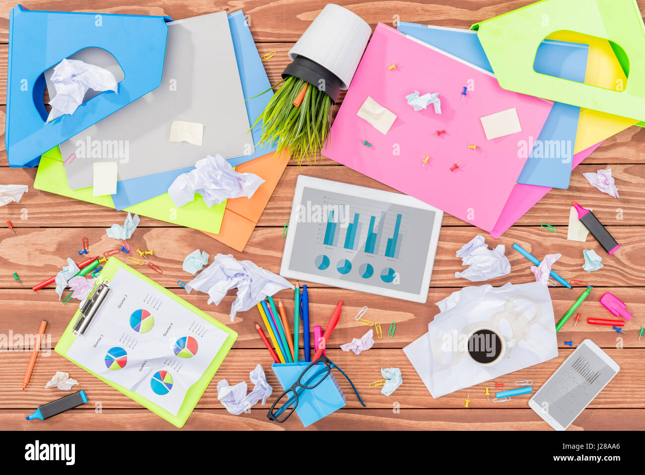 Messy office table Stock Photo - Alamy
