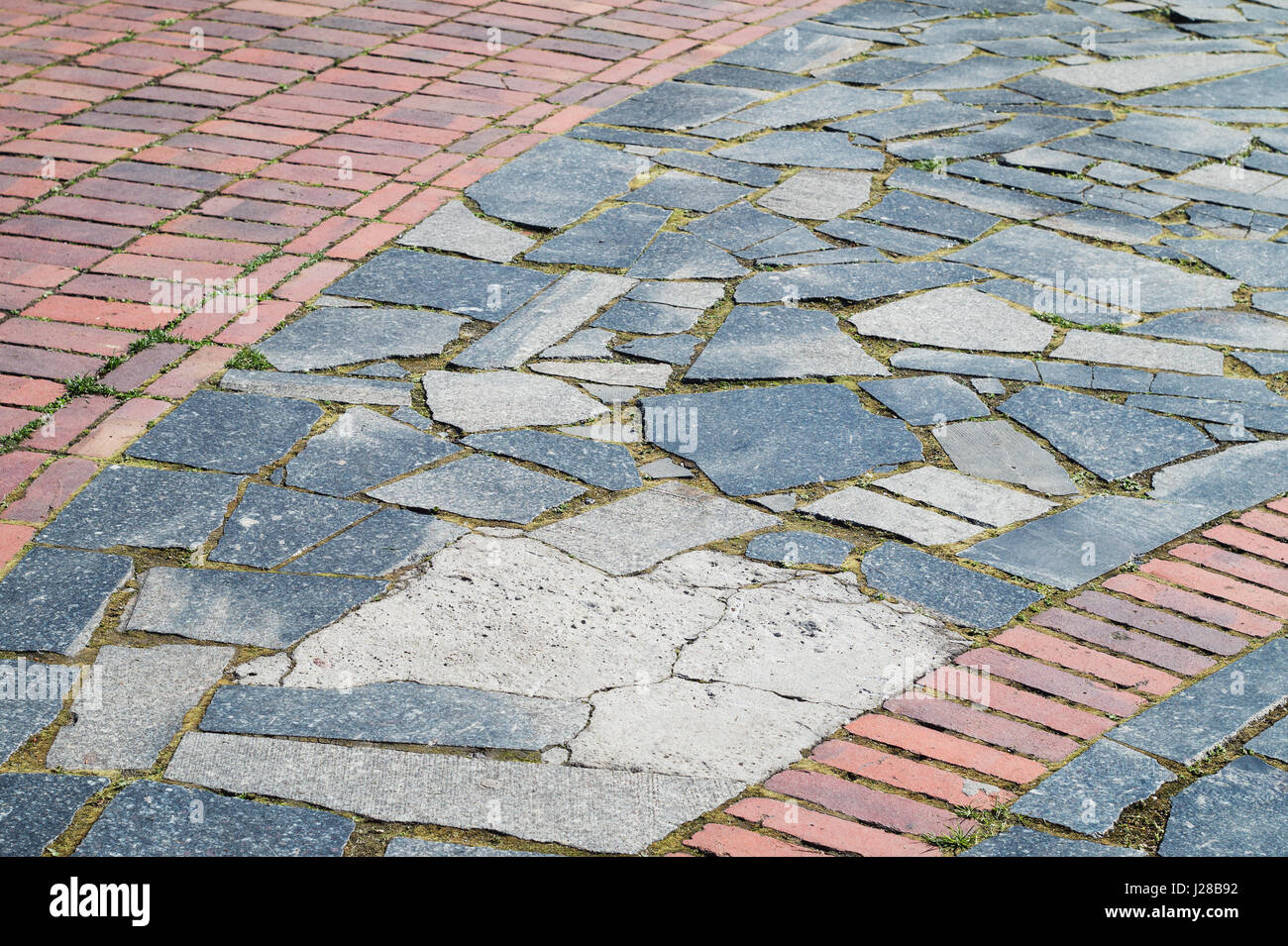 Road surface made of red bricks and granite tiles Stock Photo - Alamy