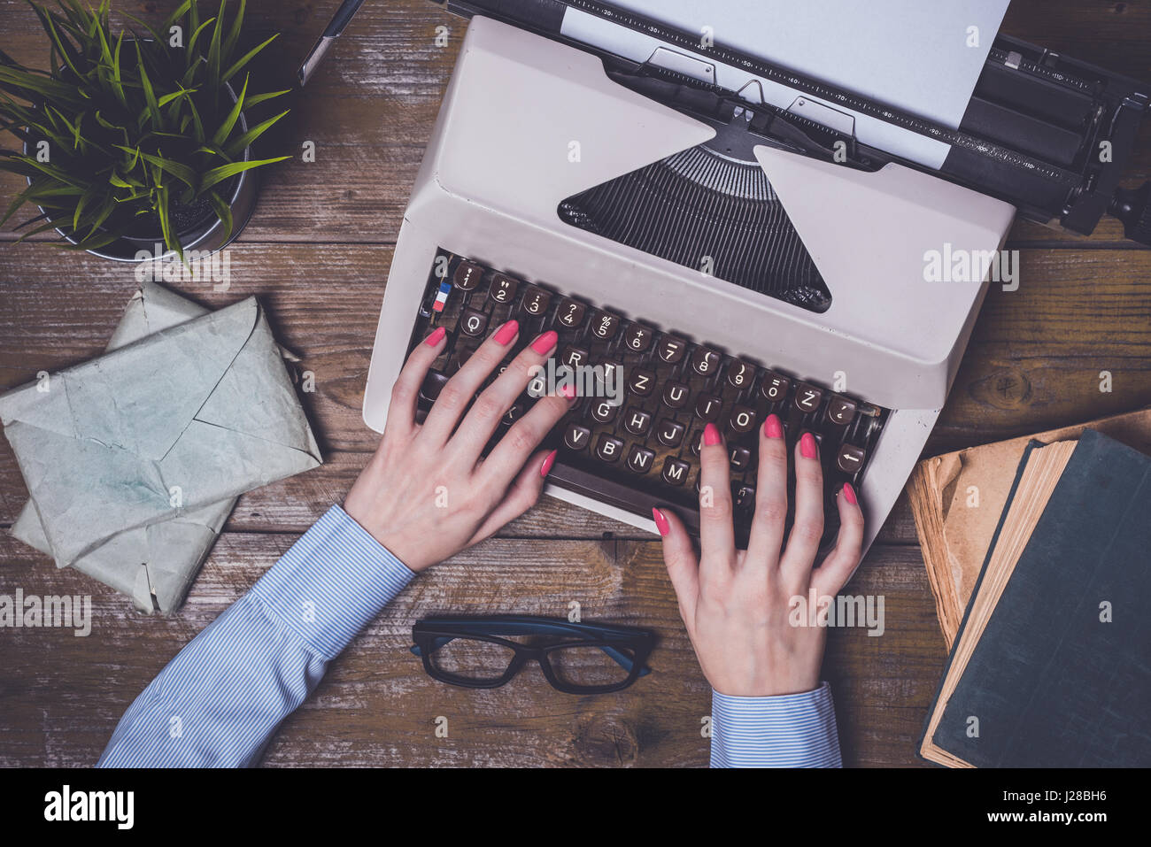 Female hands writing on an old typewriter Stock Photo - Alamy