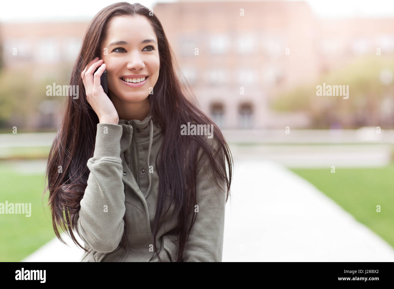 A shot of an ethnic student talking on the phone Stock Photo - Alamy