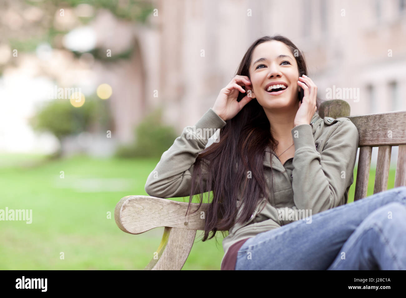 A shot of an ethnic student talking on the phone Stock Photo - Alamy
