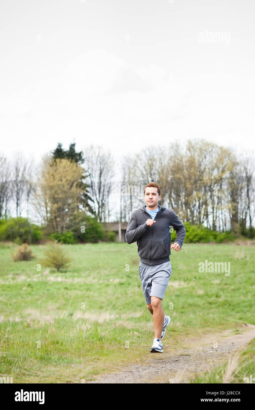 A shot of a mixed race man running outdoor Stock Photo - Alamy