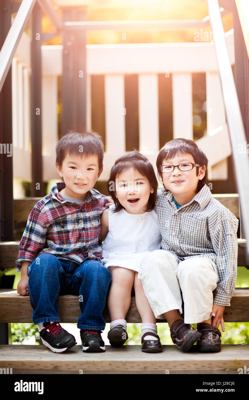 A shot of three cute little Asian kids smiling Stock Photo - Alamy