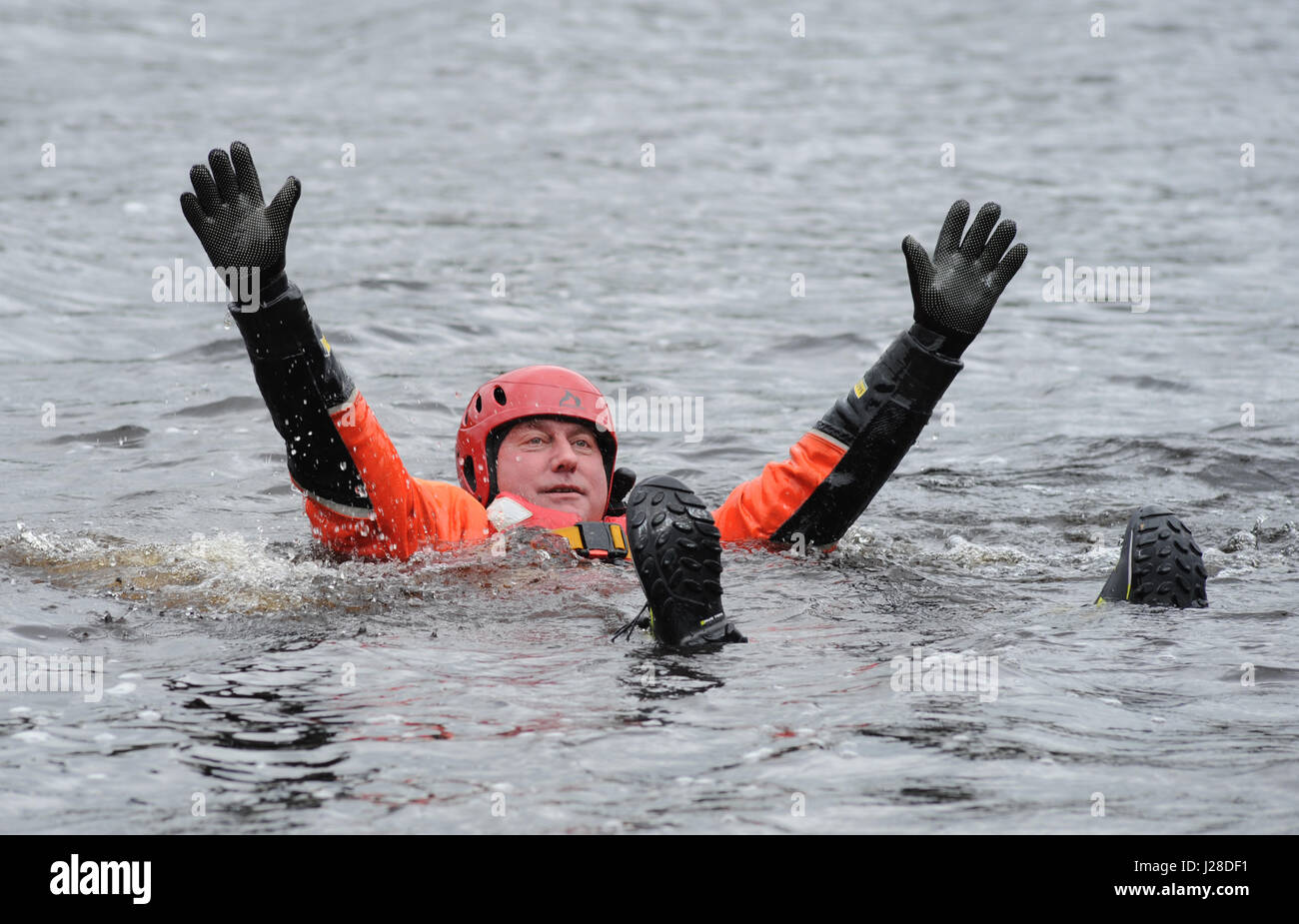 A man being rescued by firefighters during a training exercise at ...
