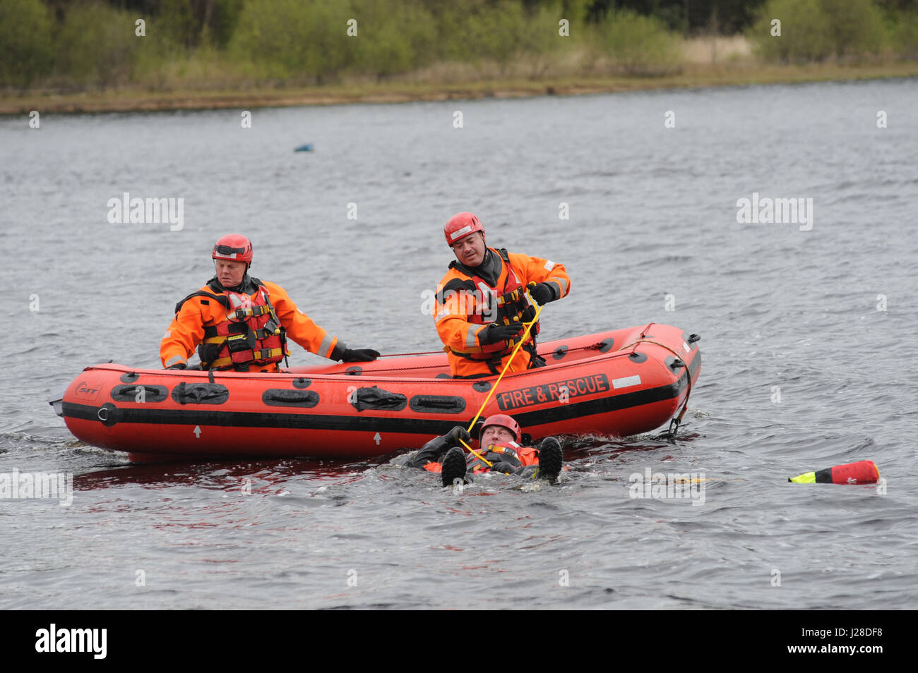A man being rescued by firefighters during a training exercise at ...