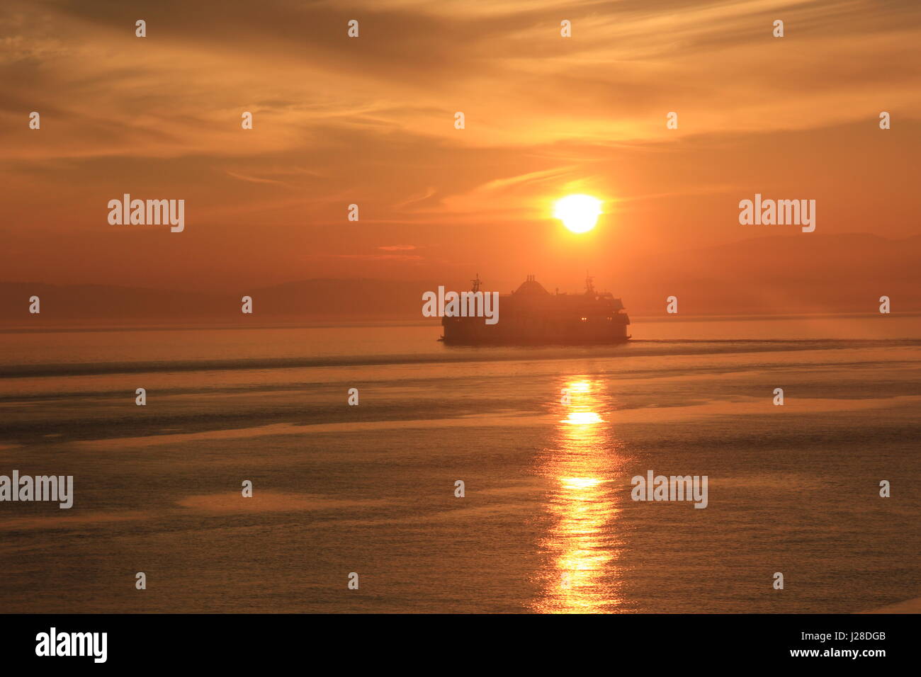 Ferries at sunset Stock Photo - Alamy
