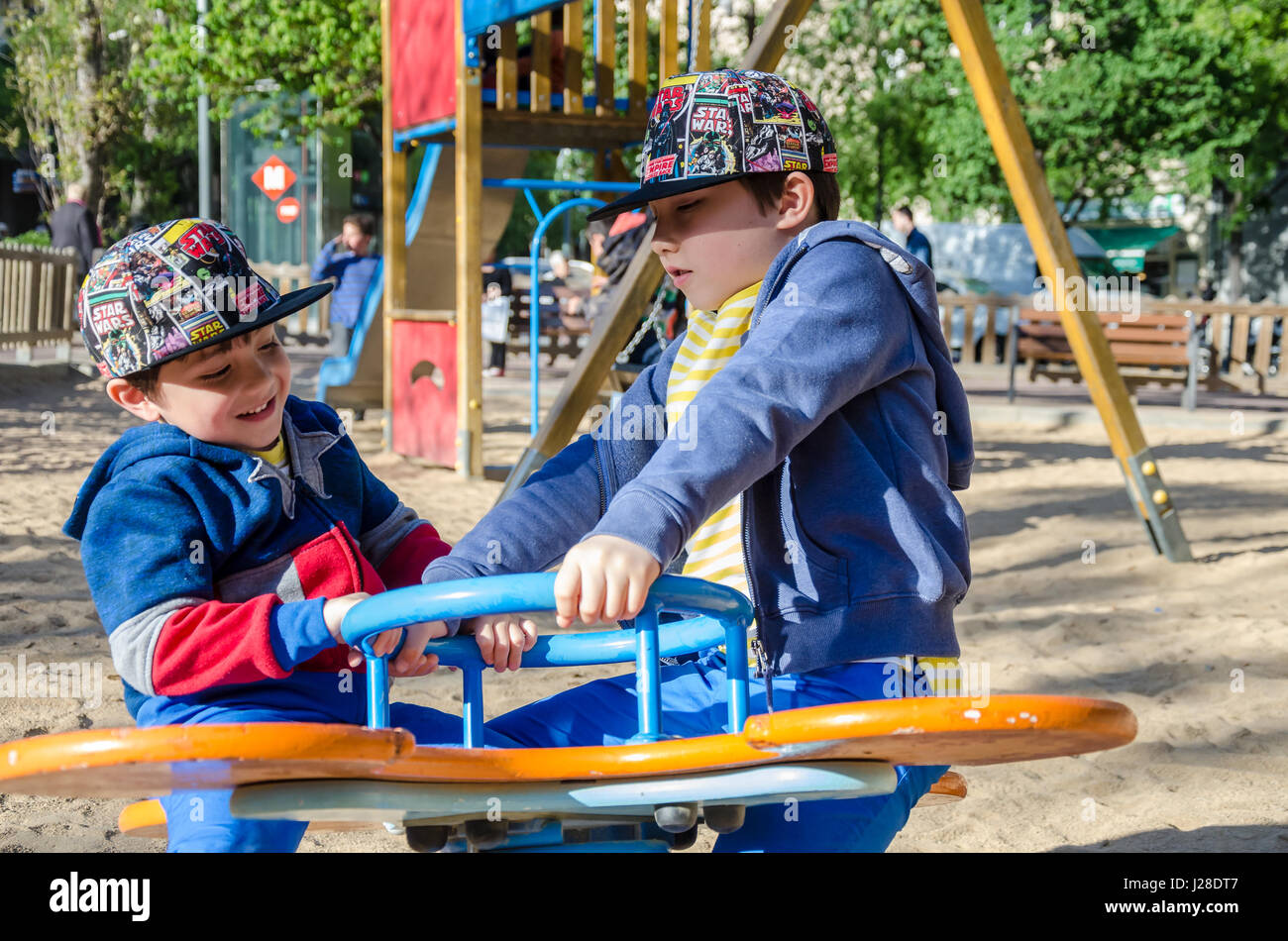 Children play on seesaw hi-res stock photography and images - Alamy
