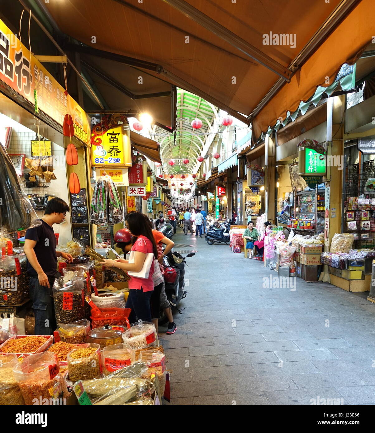 KAOHSIUNG, TAIWAN -- MAY 31, 2014: Shoppers buy goods at the famous ...